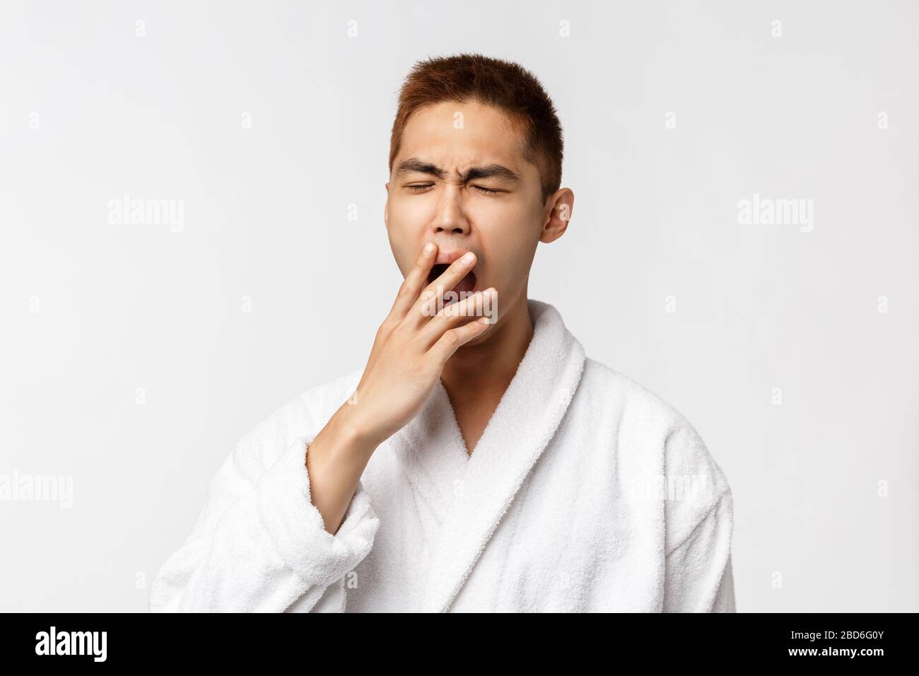 Beauty, spa and leisure concept. Portrait of young asian sleepy man ...