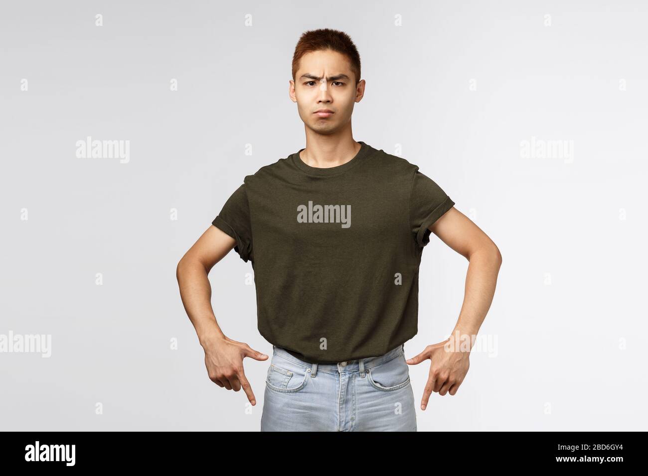 Serious-looking annoyed and disappointed young asian man complaining or ...