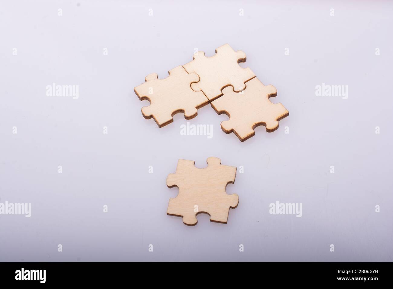 Pieces of jigsaw puzzle as problem solution concept on white background ...