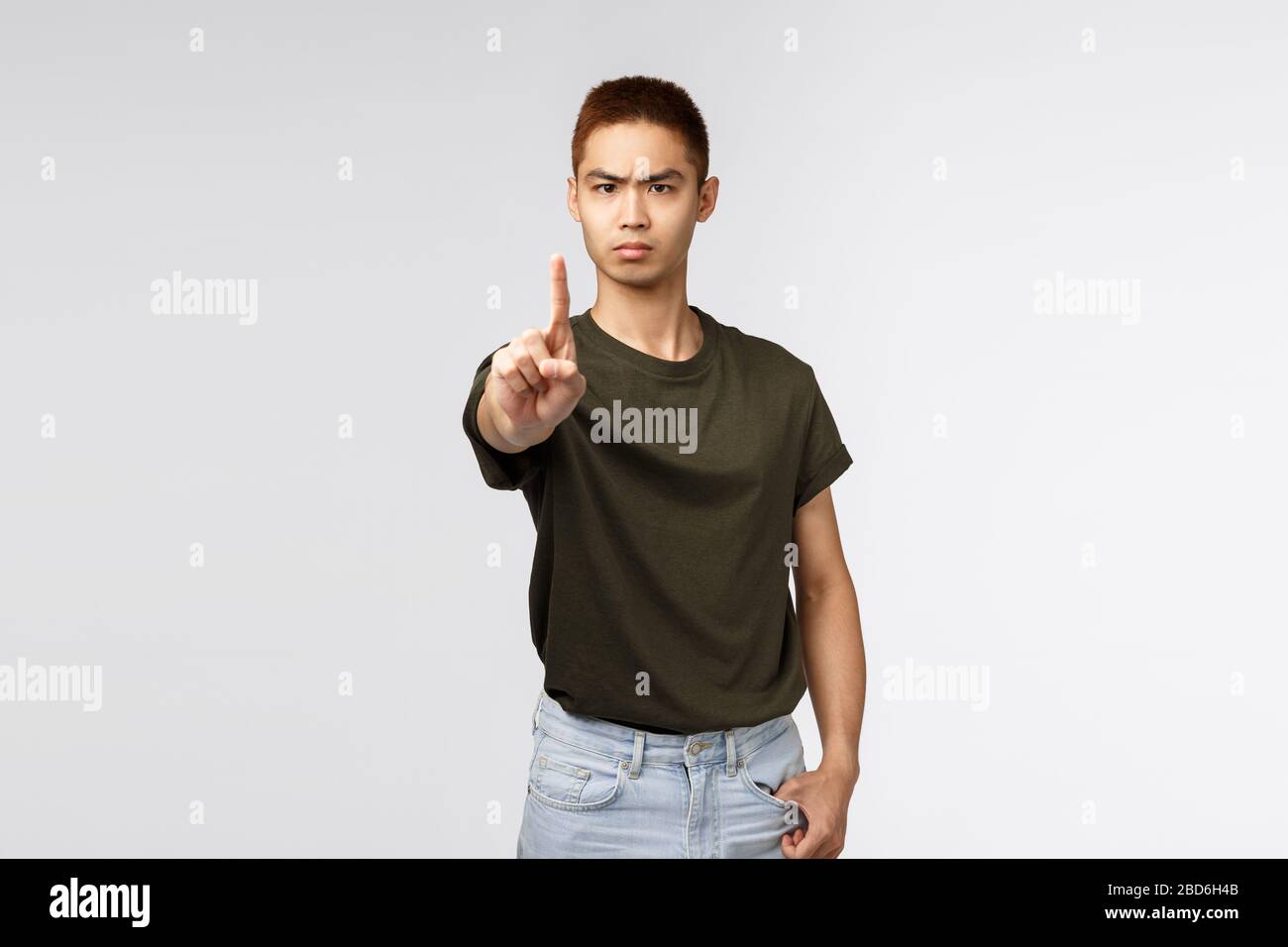 Portrait of strict and serious, angry asian man shaking finger ...