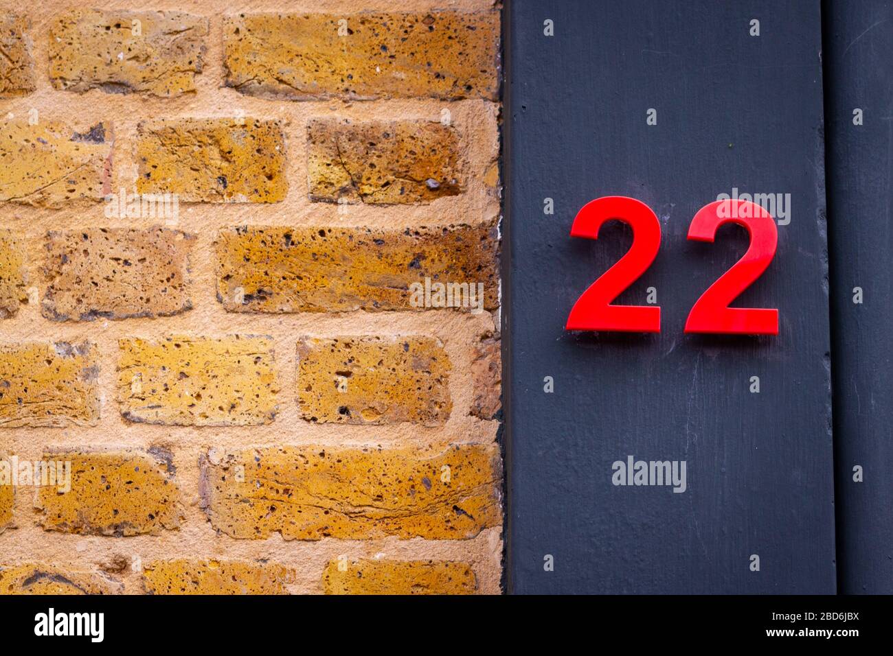 House number 22 in striking red Stock Photo - Alamy