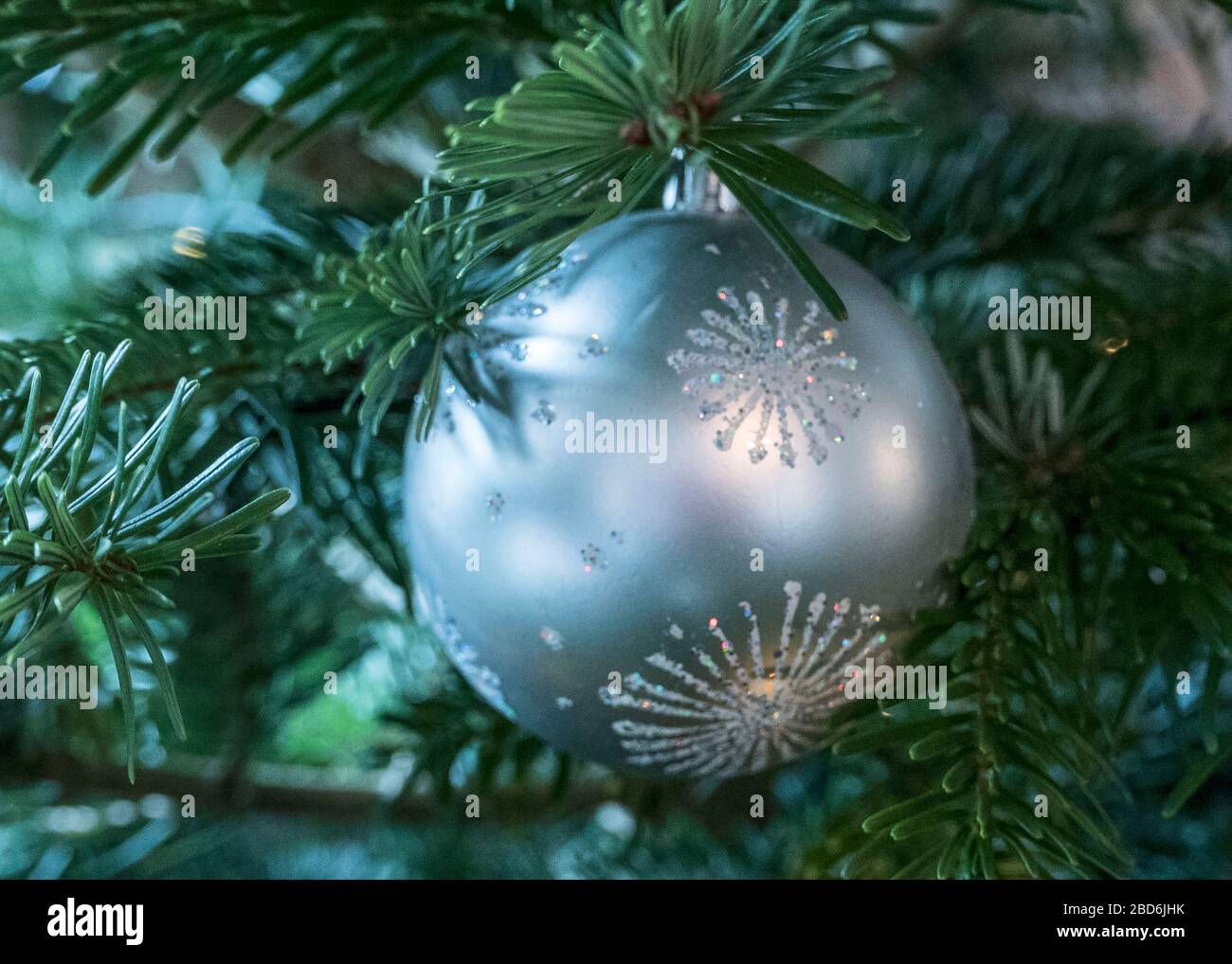 A plastic artificial Christmas tree and single bauble decoration Stock ...