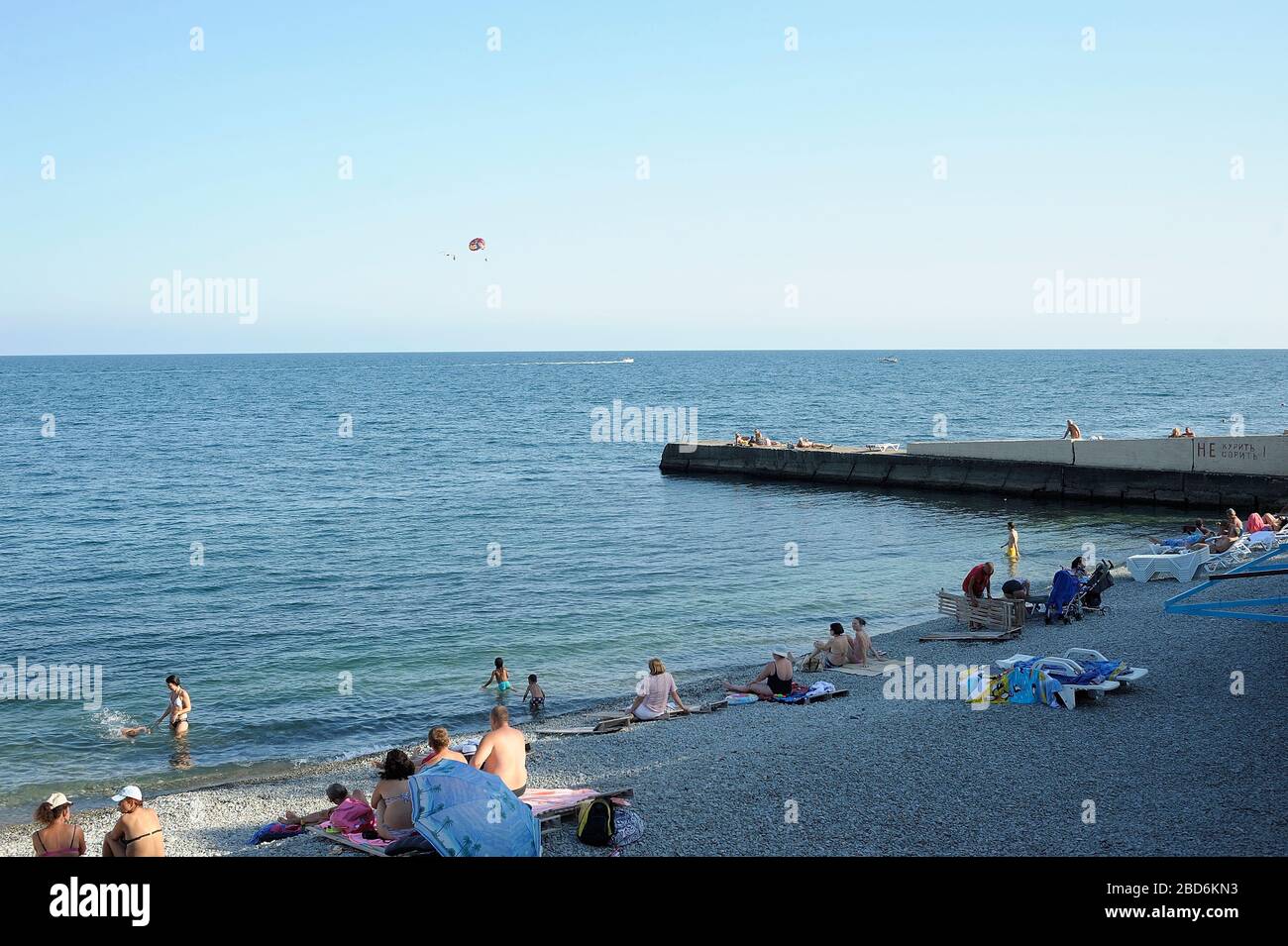 People sunbathing on a sea beach. July 12, 2018. Alushta, Crimea Stock ...