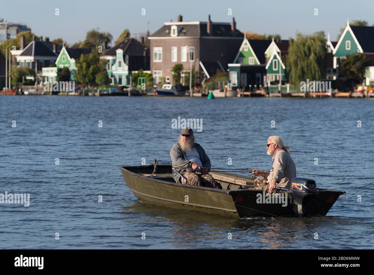 ZAANSE SCHANS, NETHERLANDS - OCTOBER 13, 2018: Two unknown men fishing ...