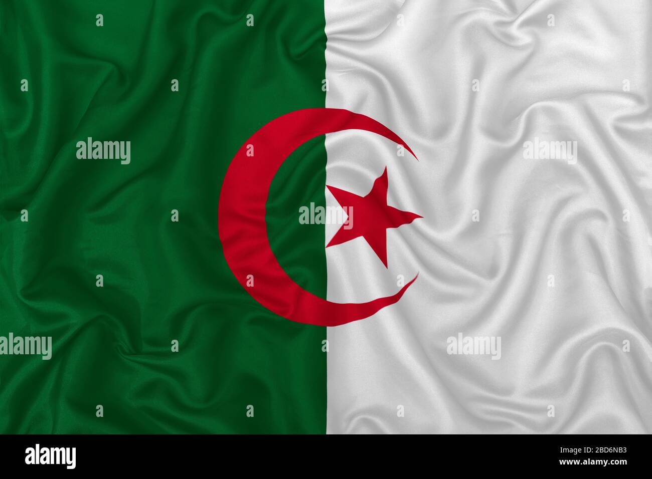 Algeria country flag on wavy silk textile fabric background Stock Photo ...