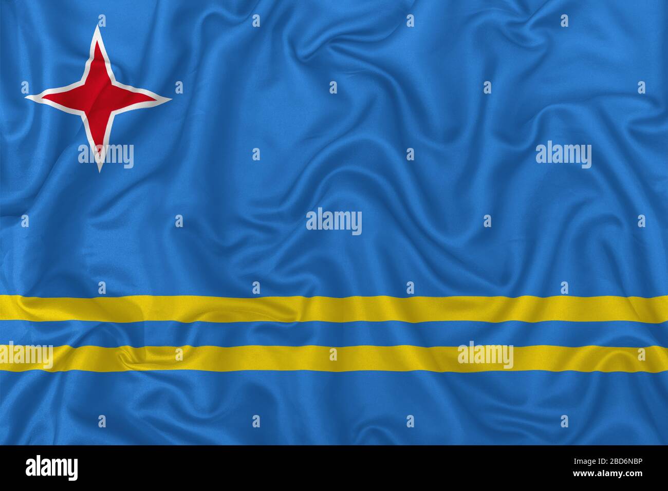 Aruba country flag on wavy silk textile fabric background Stock Photo ...
