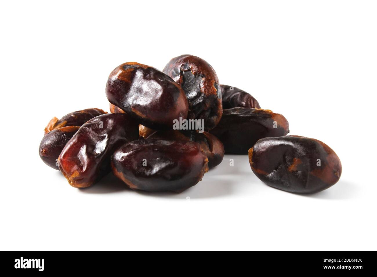 Handful of dried dates close up isolated on white Stock Photo - Alamy