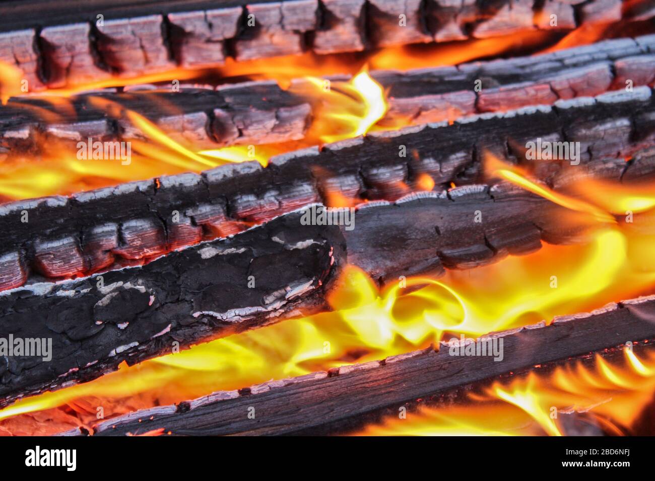 Firewood burning flame in the fire closeup Stock Photo - Alamy