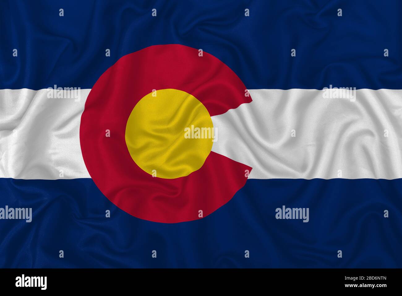 Colorado state flag on a wavy silk satin fabric texture background ...