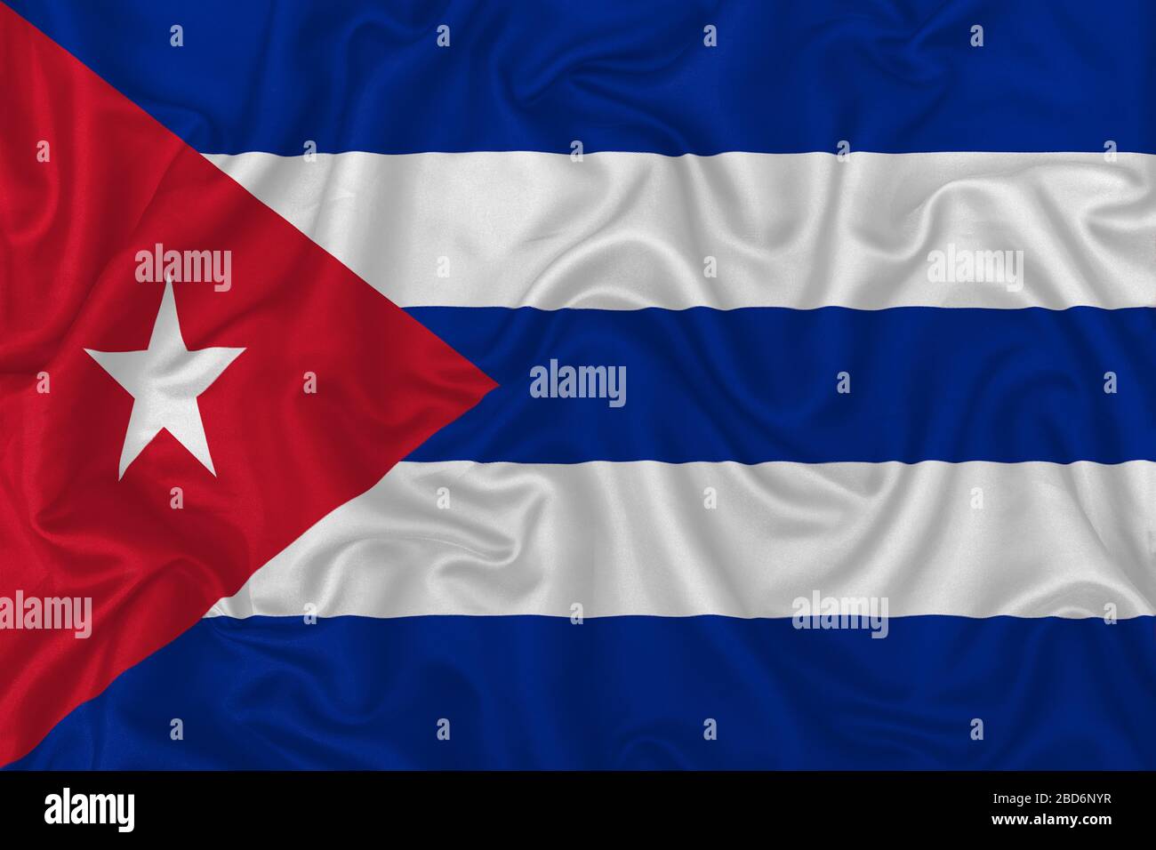 Cuba country flag on wavy silk textile fabric background Stock Photo ...
