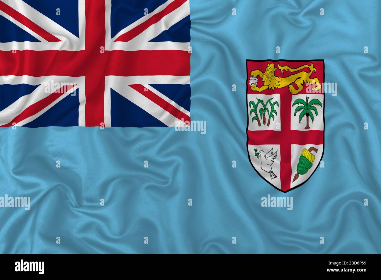 Fiji country flag on wavy silk textile fabric background Stock Photo ...