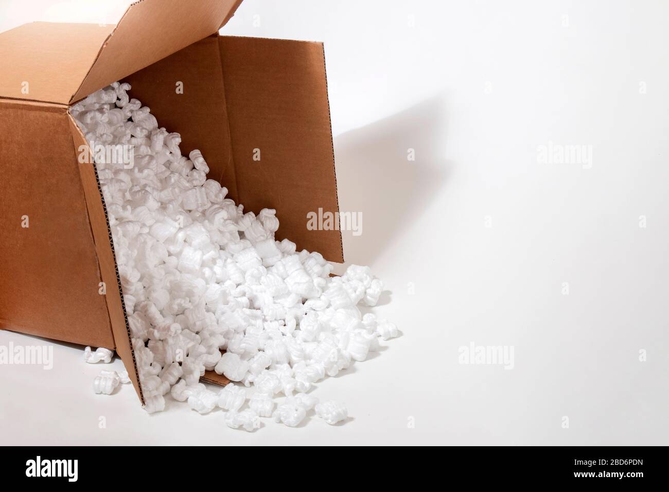 Cardbox spills plenty of polystyrene or white styrofoam packing pieces ...