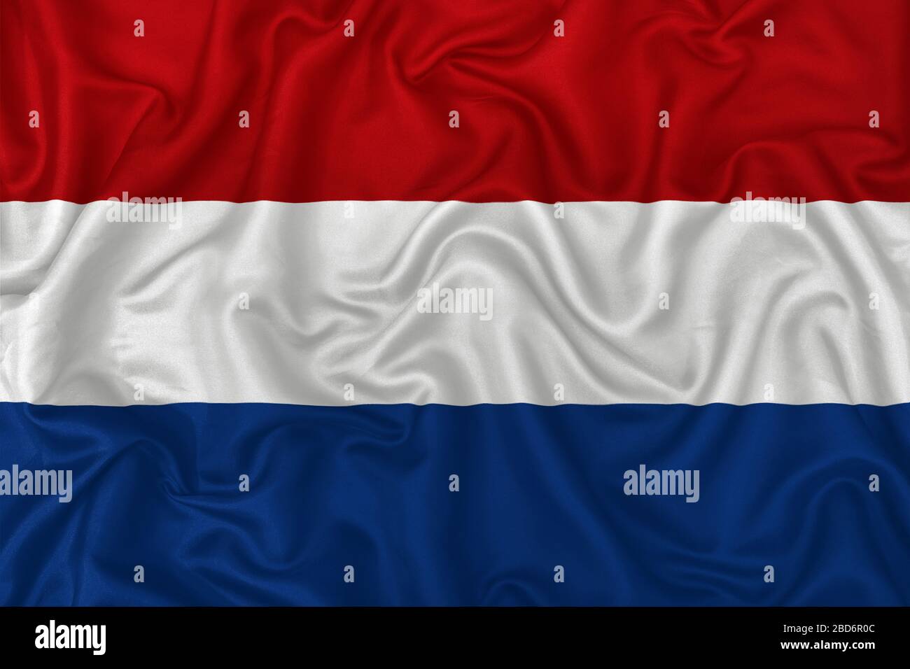 Netherlands country flag on wavy silk textile fabric background Stock ...