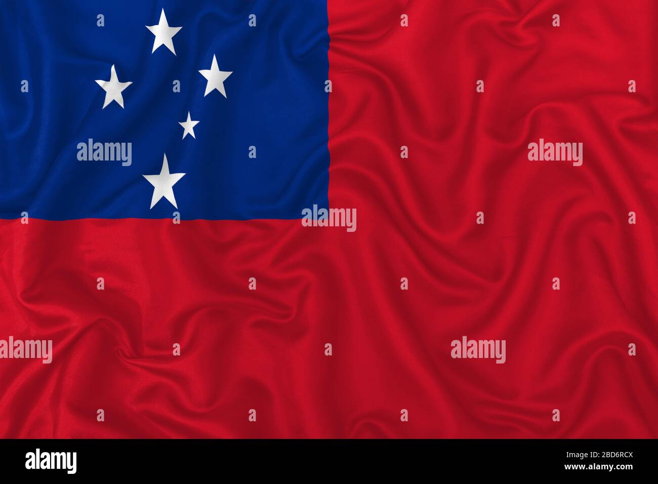 Samoa country flag on wavy silk textile fabric background Stock Photo ...