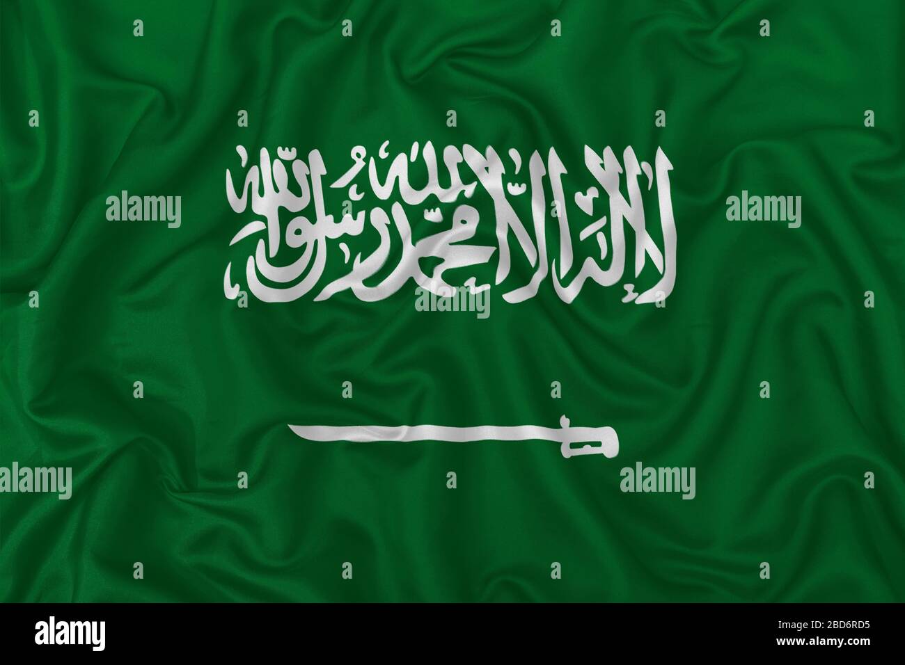 Saudi Arabia country flag on wavy silk textile fabric background Stock ...