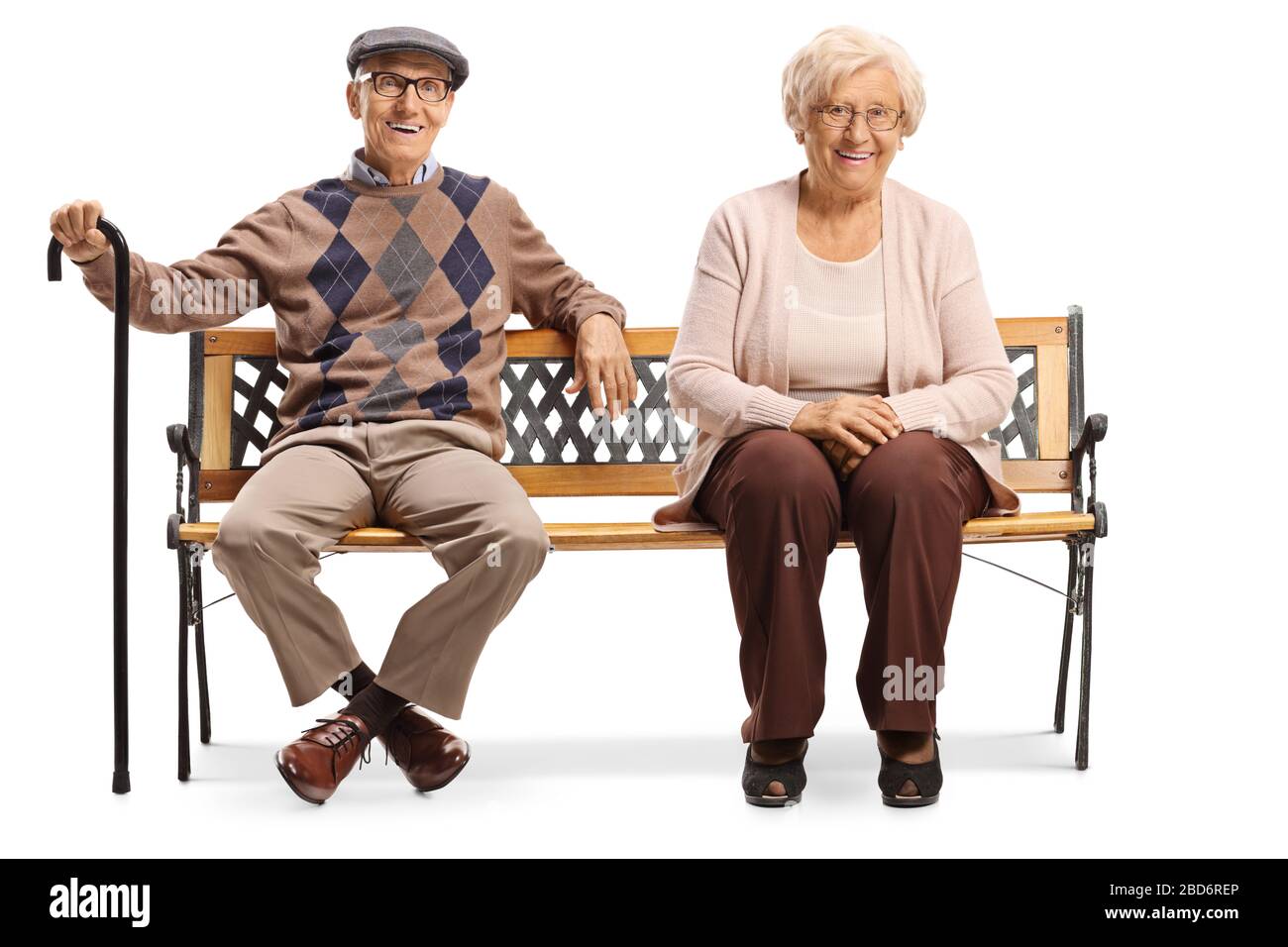 Seniors smiling and sitting on a bench isolated on white background ...