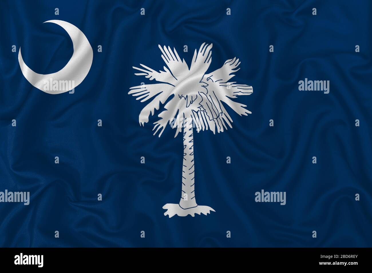 South Carolina state flag on a wavy silk satin fabric texture ...