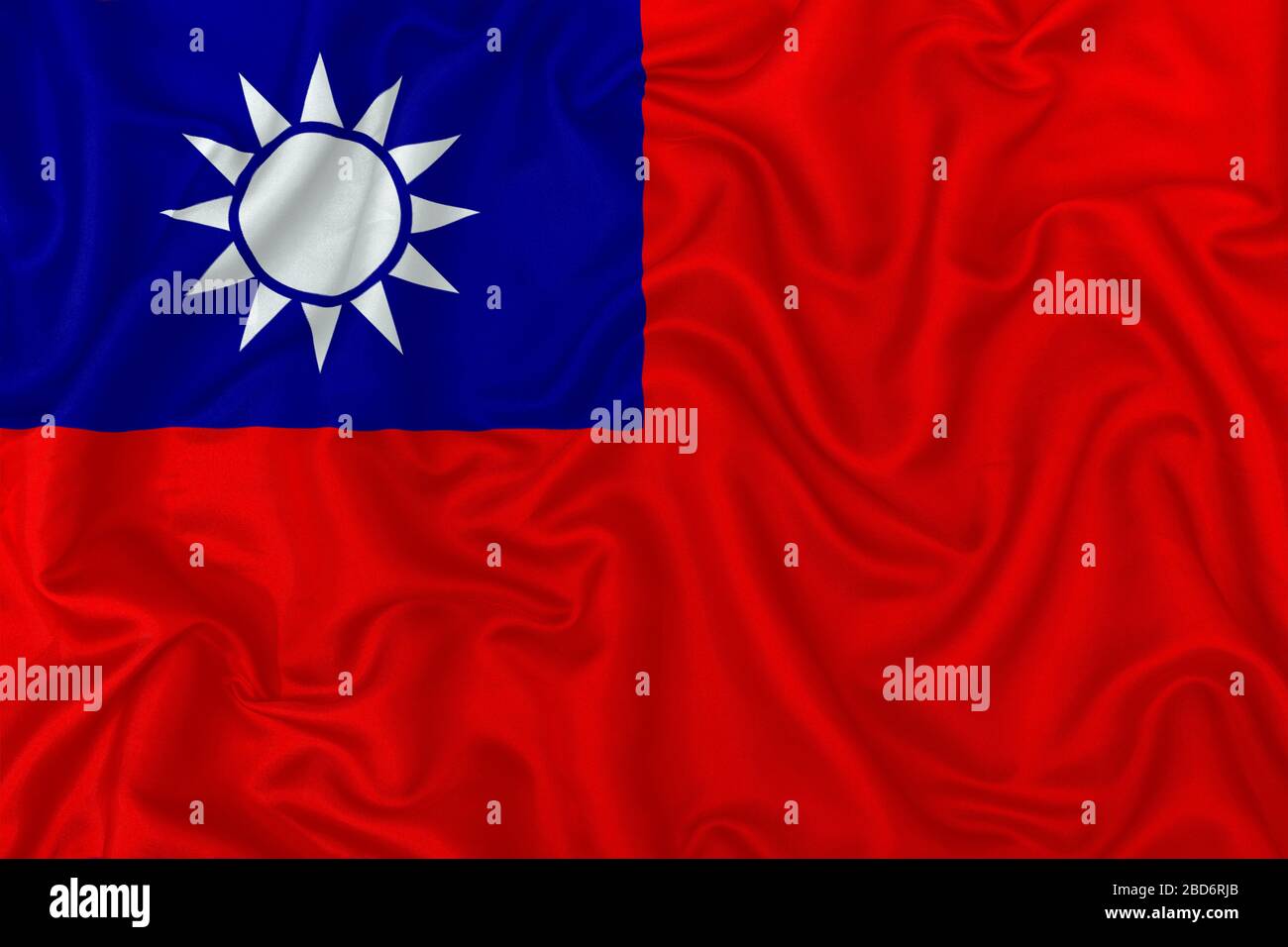 Taiwan state flag on wavy silk textile fabric background Stock Photo ...