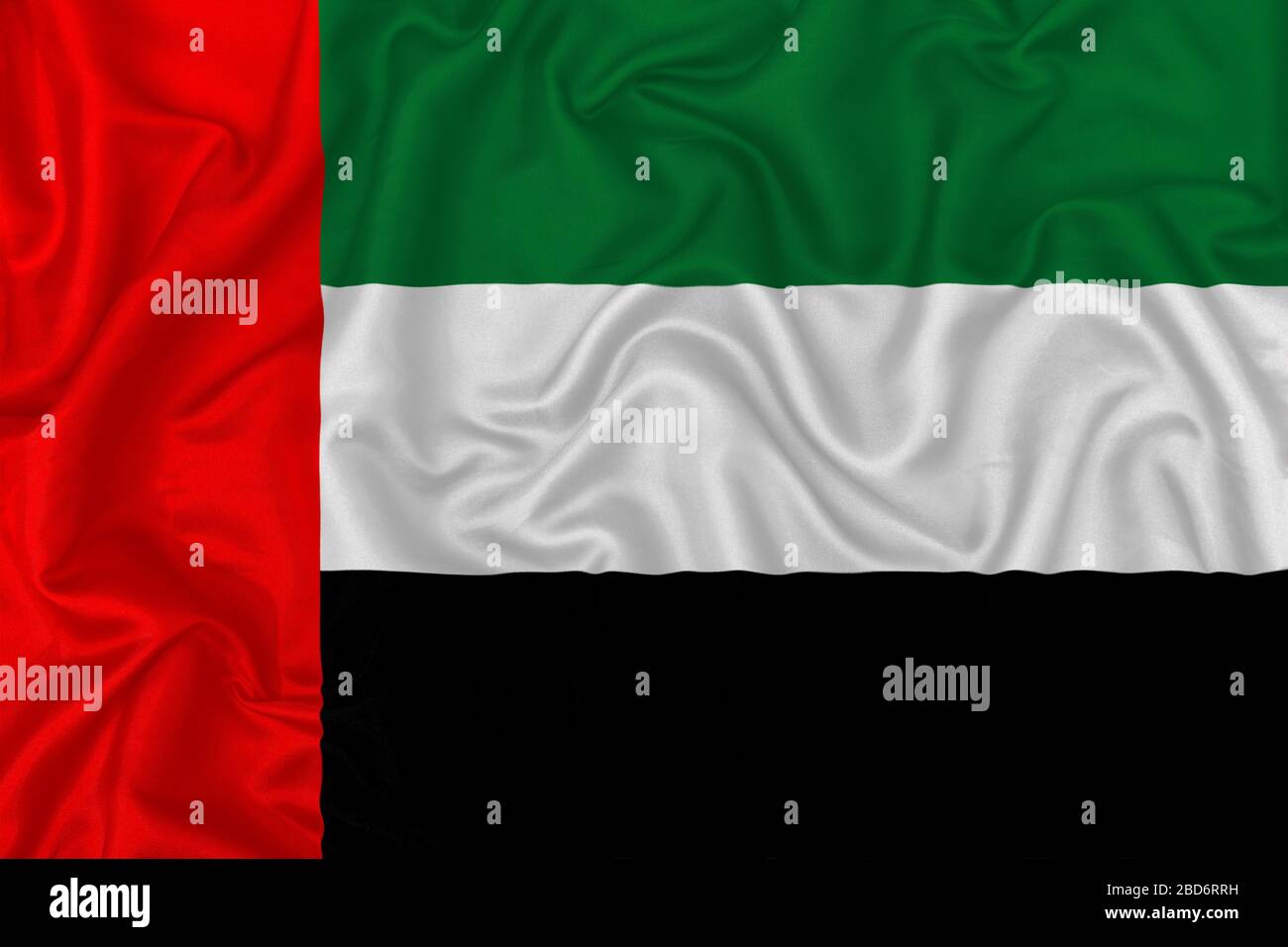 United Arab Emirates country flag on wavy silk textile fabric ...