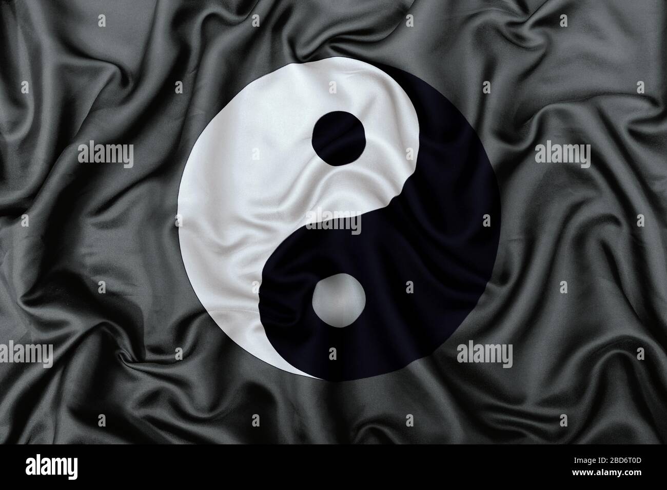 Yin and Yang symbol on a silk satin fabric texture background Stock ...