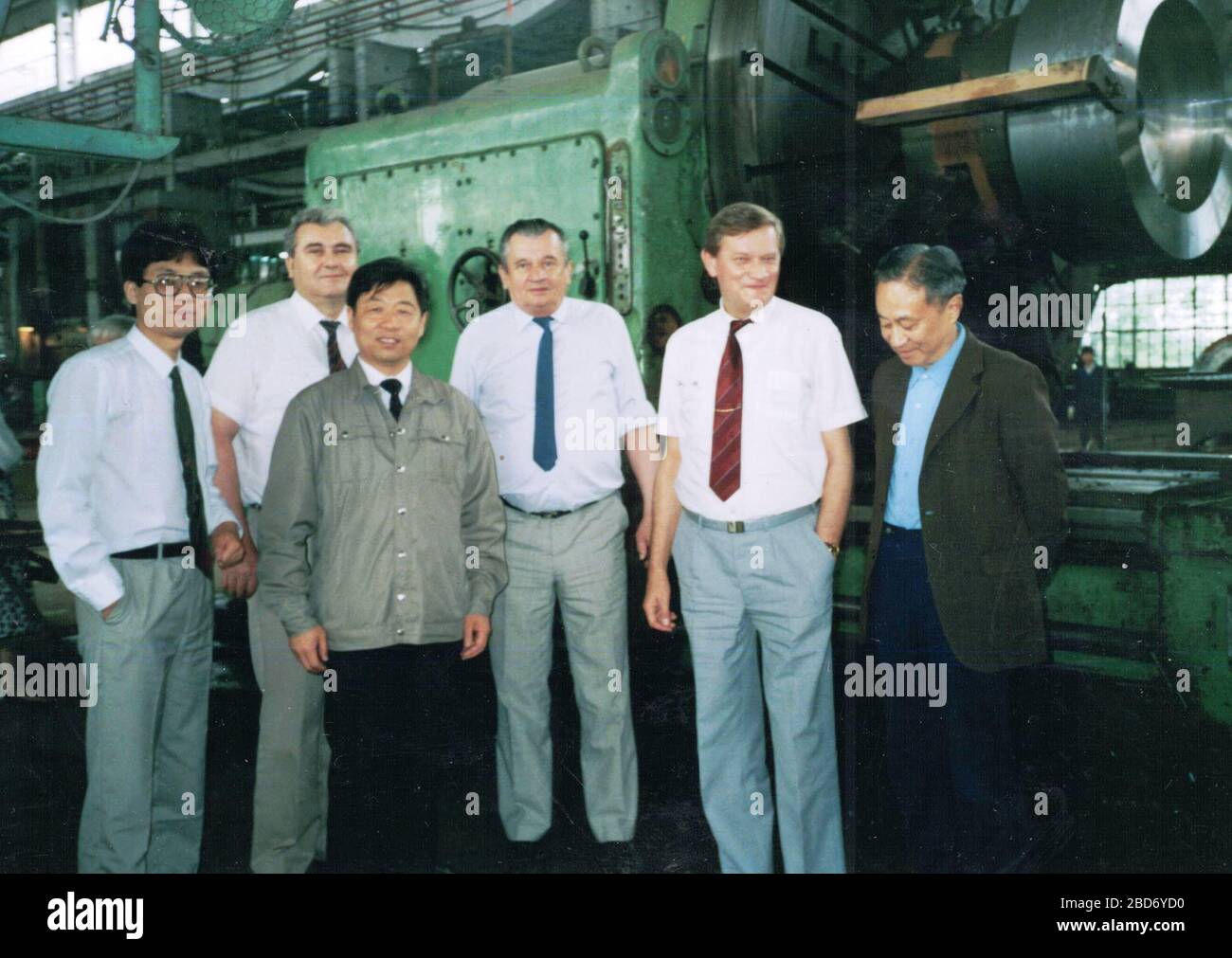 CHINA - 1989: Retro photo shows a group of European businessmen and ...