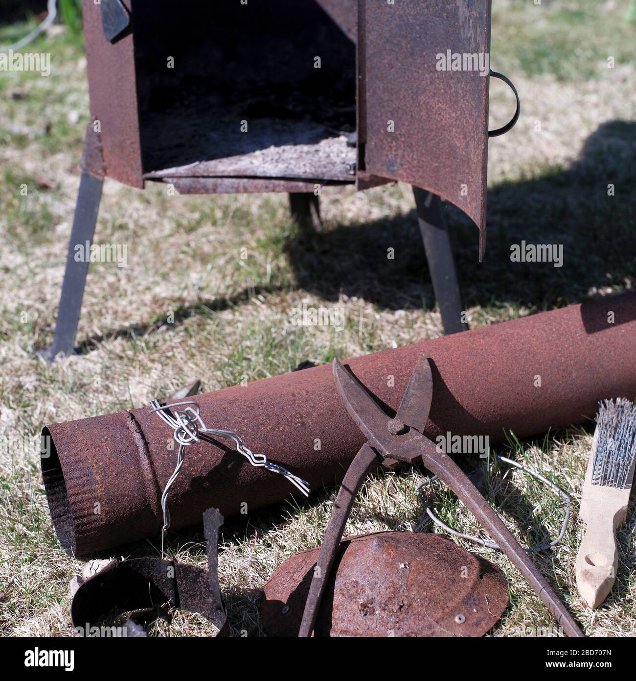 Fixing old wood burning garden cooker,outdoor close up Stock Photo - Alamy