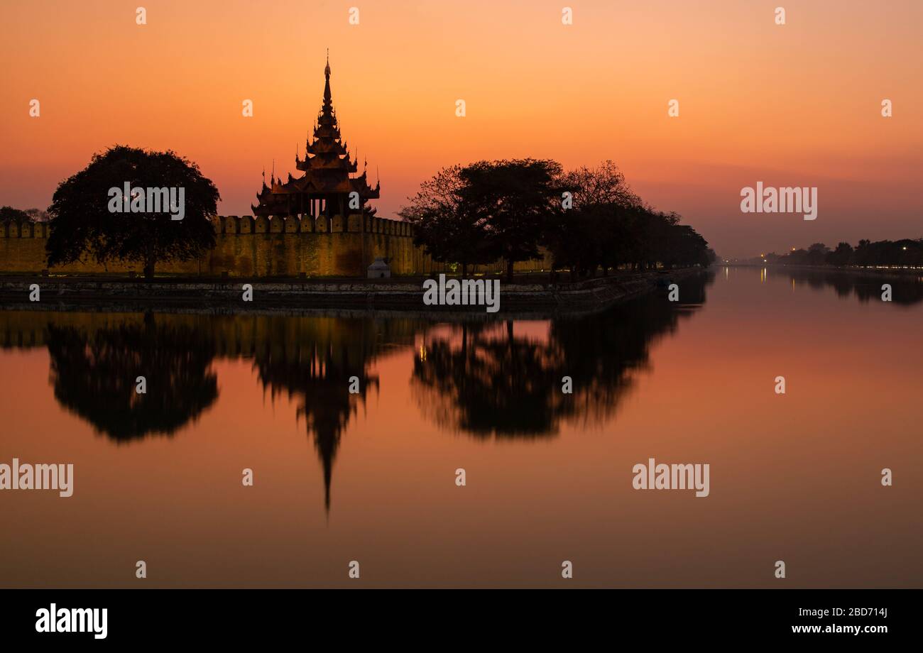 Sunset with colored sky of one of the four watch towers of the palace ...