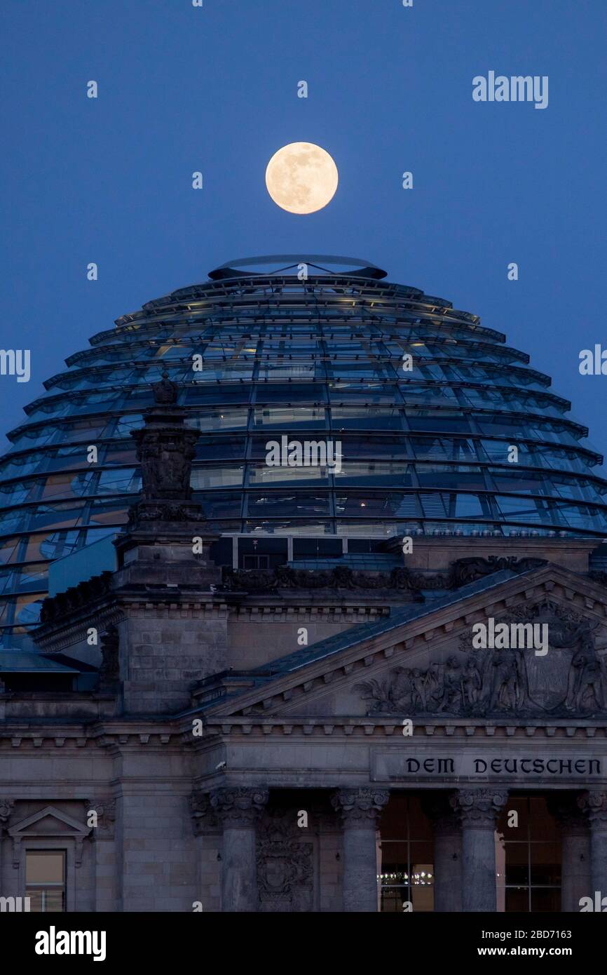 Berlin, Germany. 07th Apr, 2020. The moon rises as a so-called ...