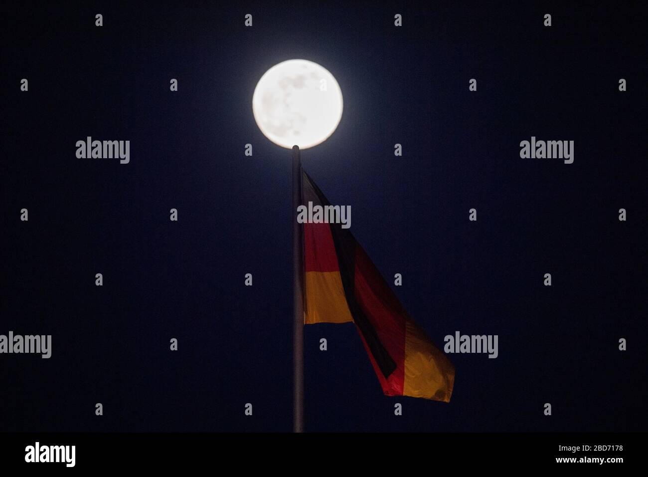 Berlin, Germany. 07th Apr, 2020. The moon rises as a so-called ...