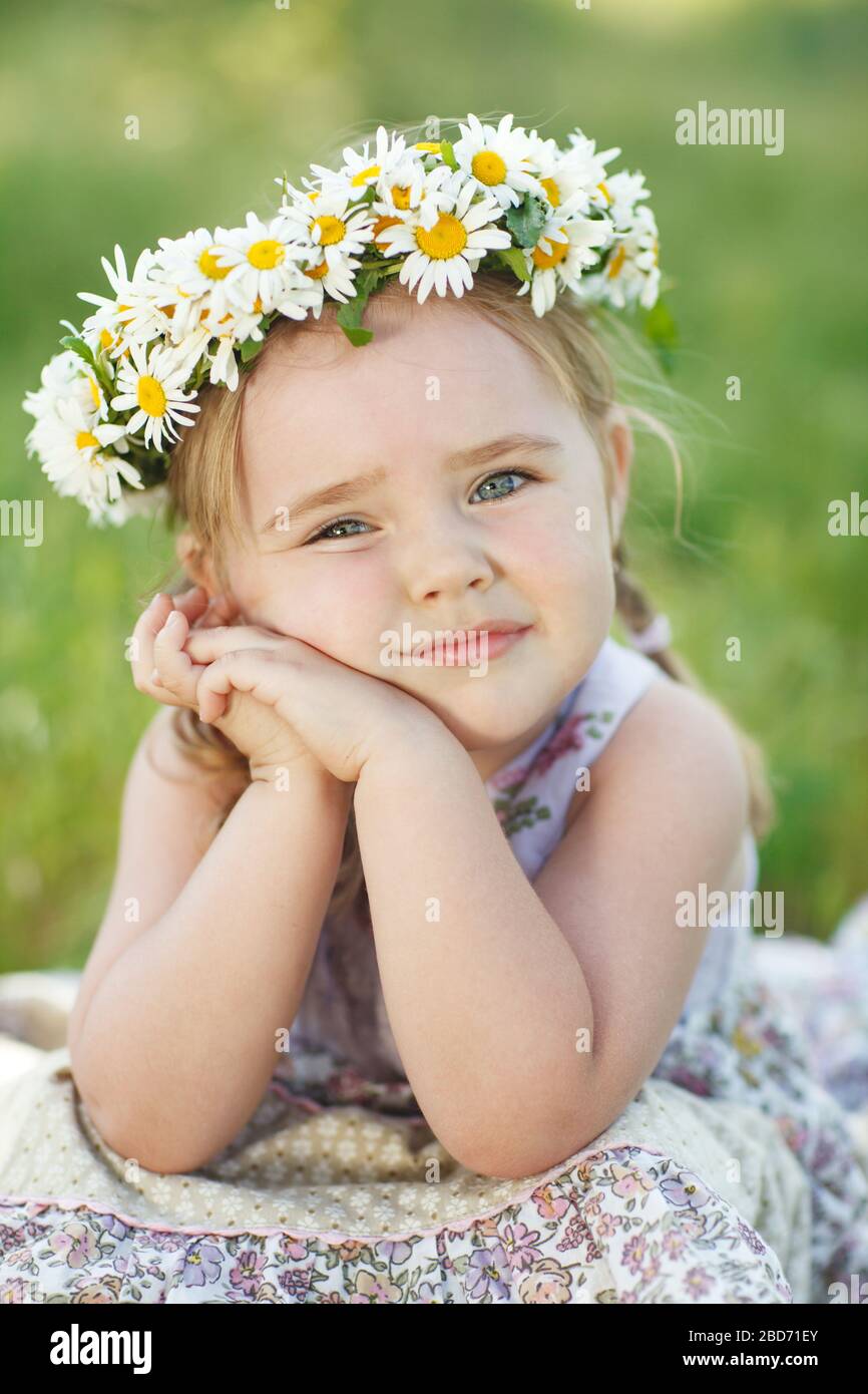A child with a wreath of flowers Stock Photo - Alamy
