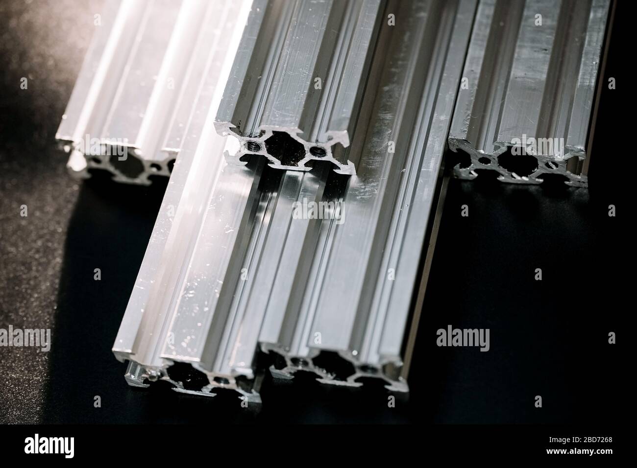 v slot aluminum profile lies on a black table, work surface with a ...