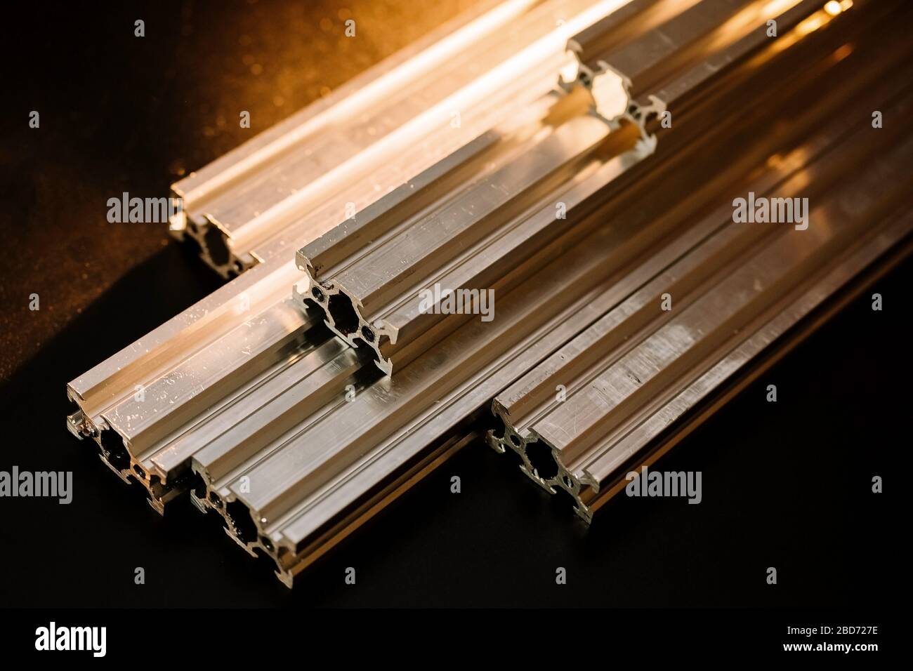 v slot aluminum profile lies on a black table, work surface with a ...