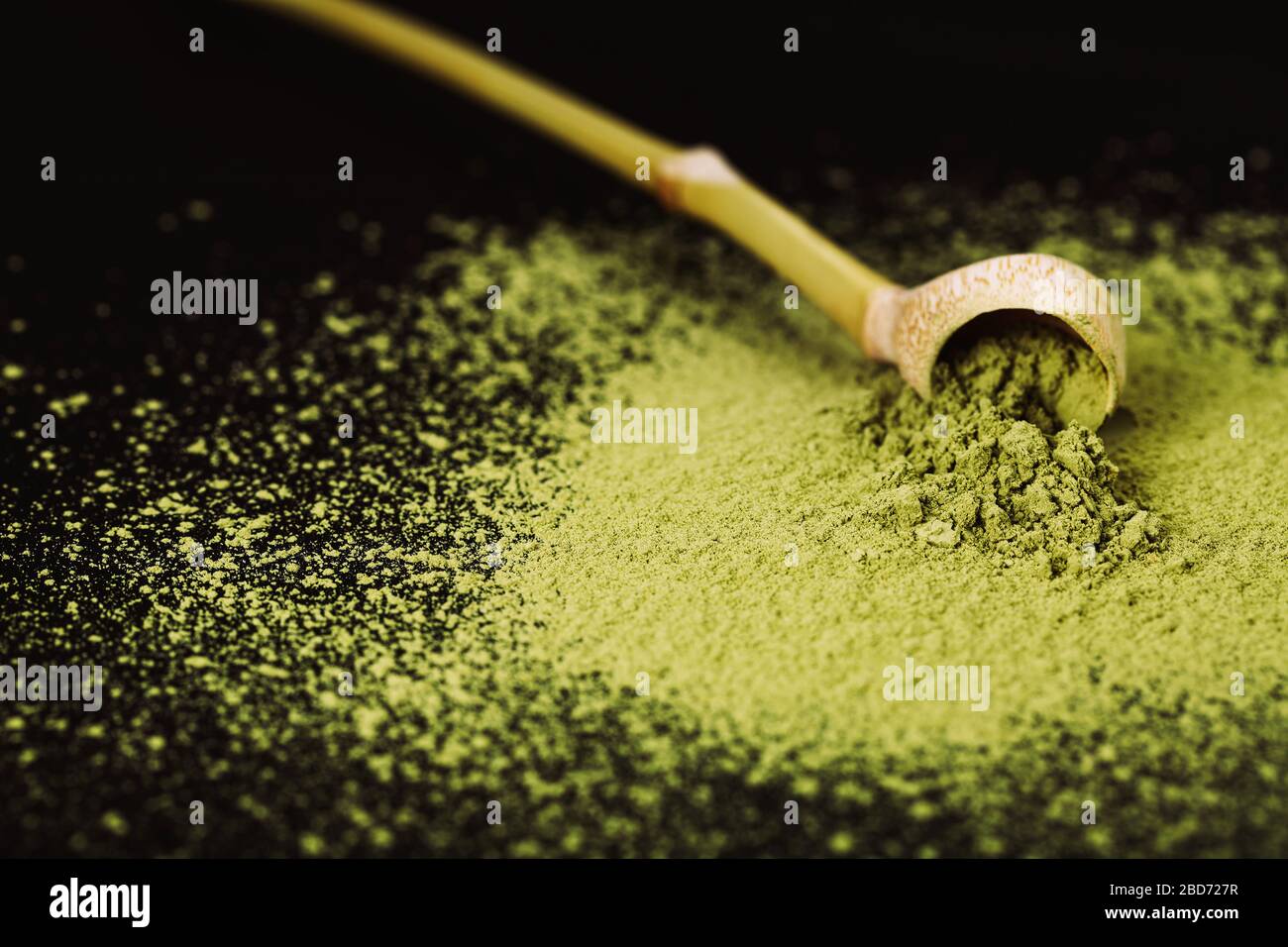 Special bamboo spoon for green powdered matha tea isolated on black ...