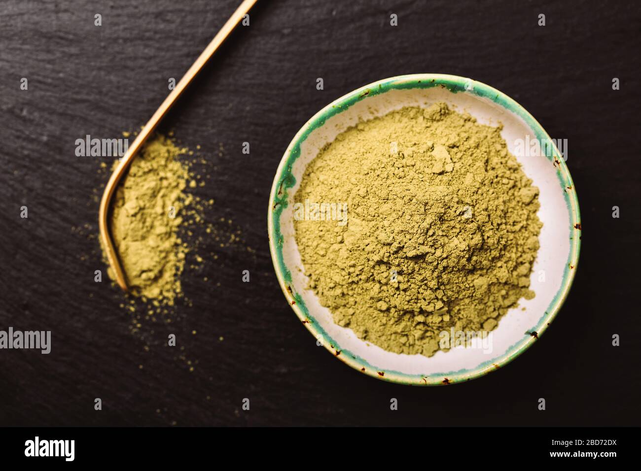 Spoon for matcha tea and green pouder in special ceramics sauser. Black ...