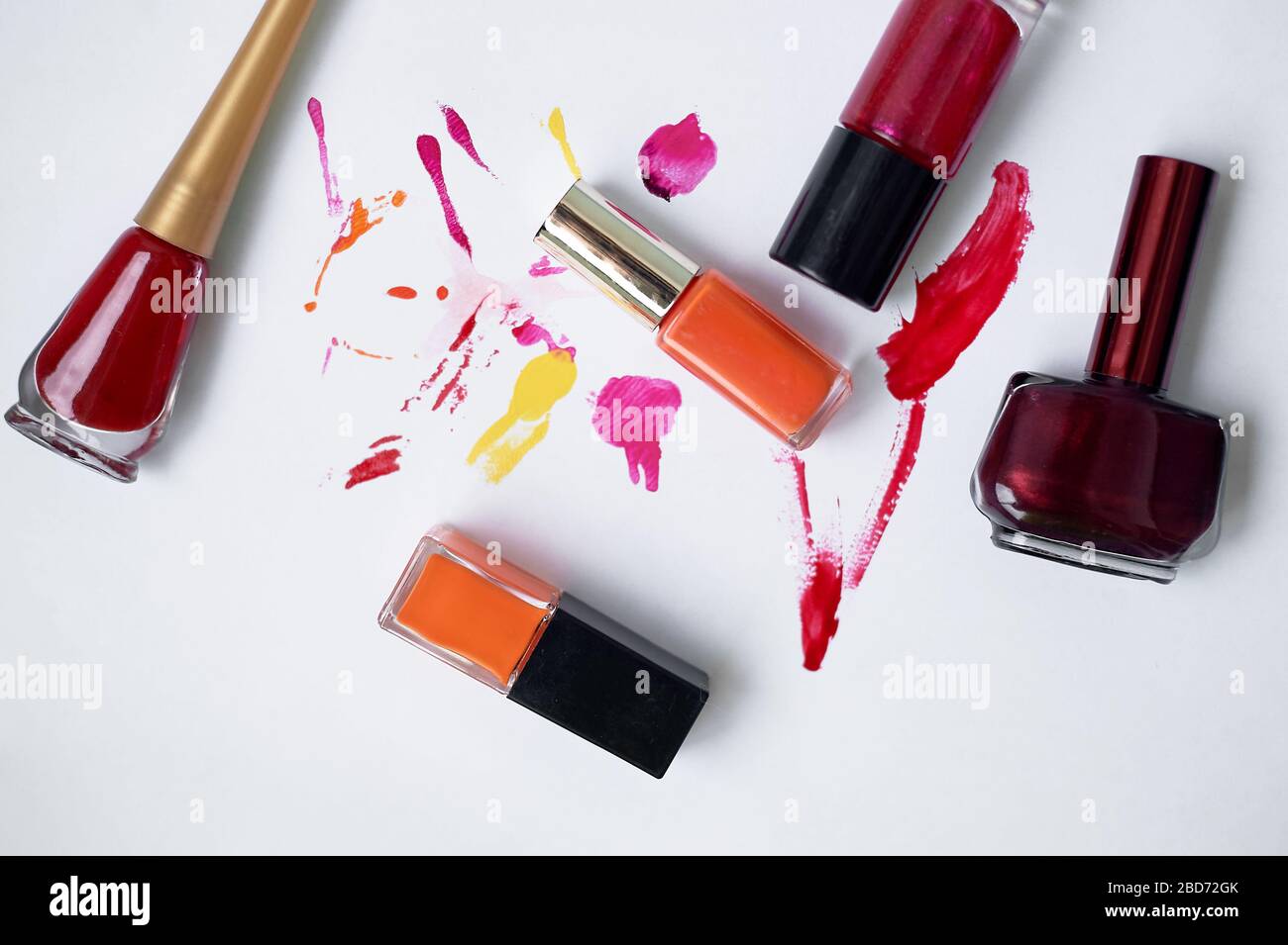 Lucky on a white background, with smears of varnish. Orange, burgundy ...