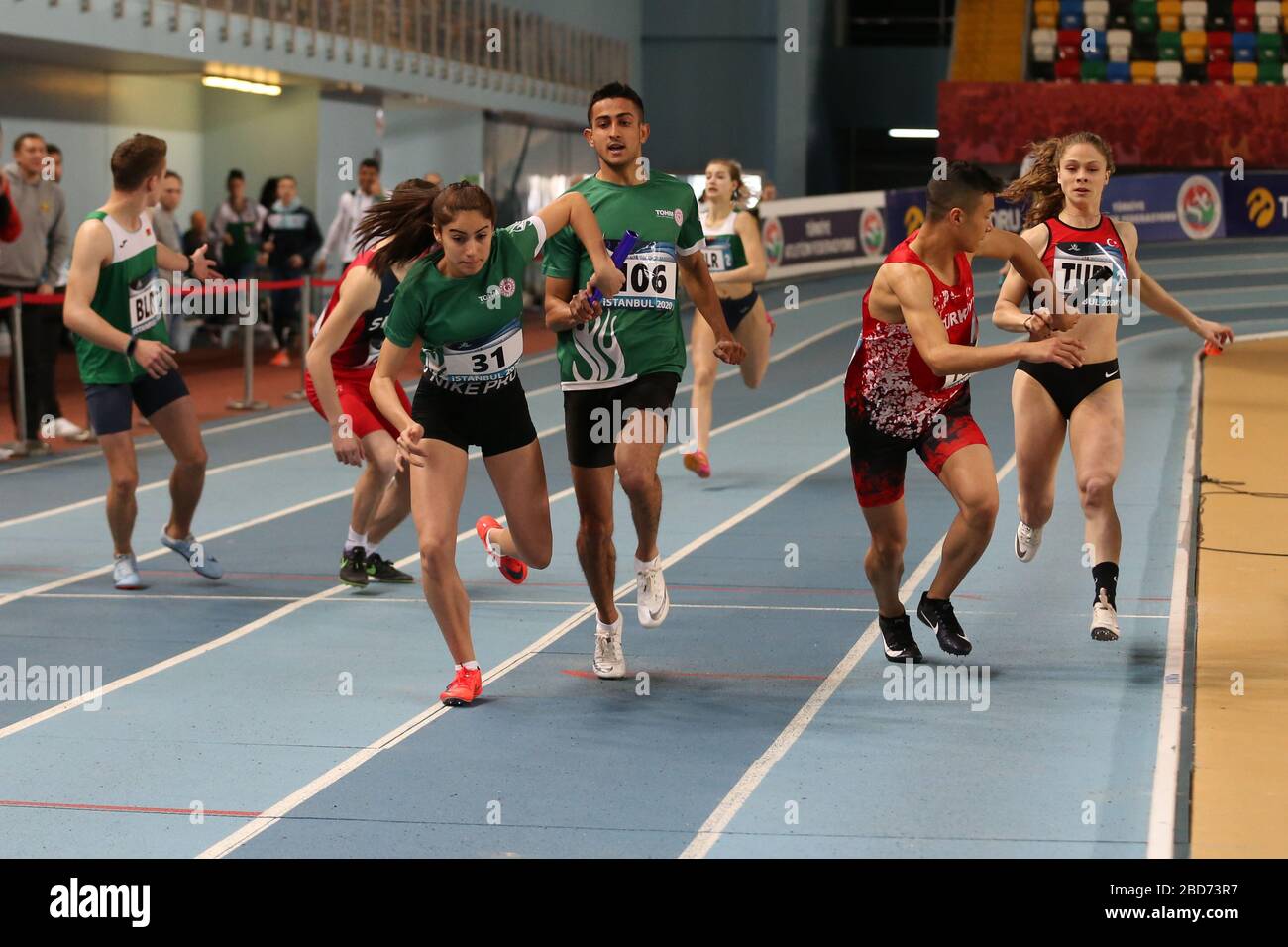 ISTANBUL, TURKEY - MARCH 07, 2020: Athletes running 4x200 relay race ...