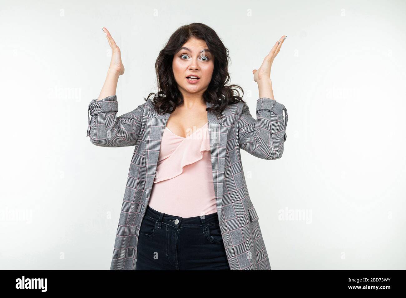 indignant girl in a classic plaid jacket on a white background Stock ...