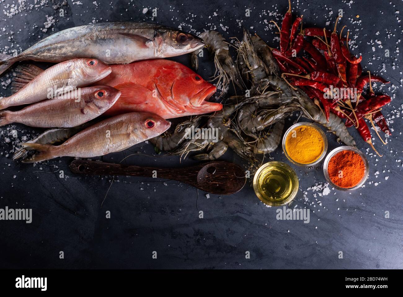 Red Snapper raw fish on table top Stock Photo - Alamy