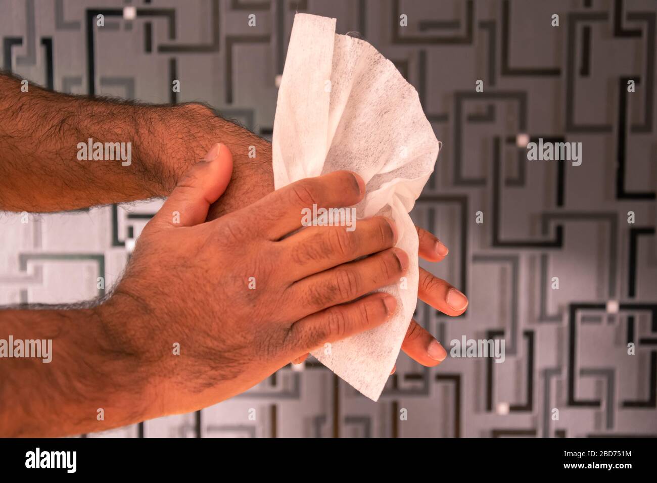 Cleaning hand with anti bacterial wipes , Sweden Stock Photo - Alamy