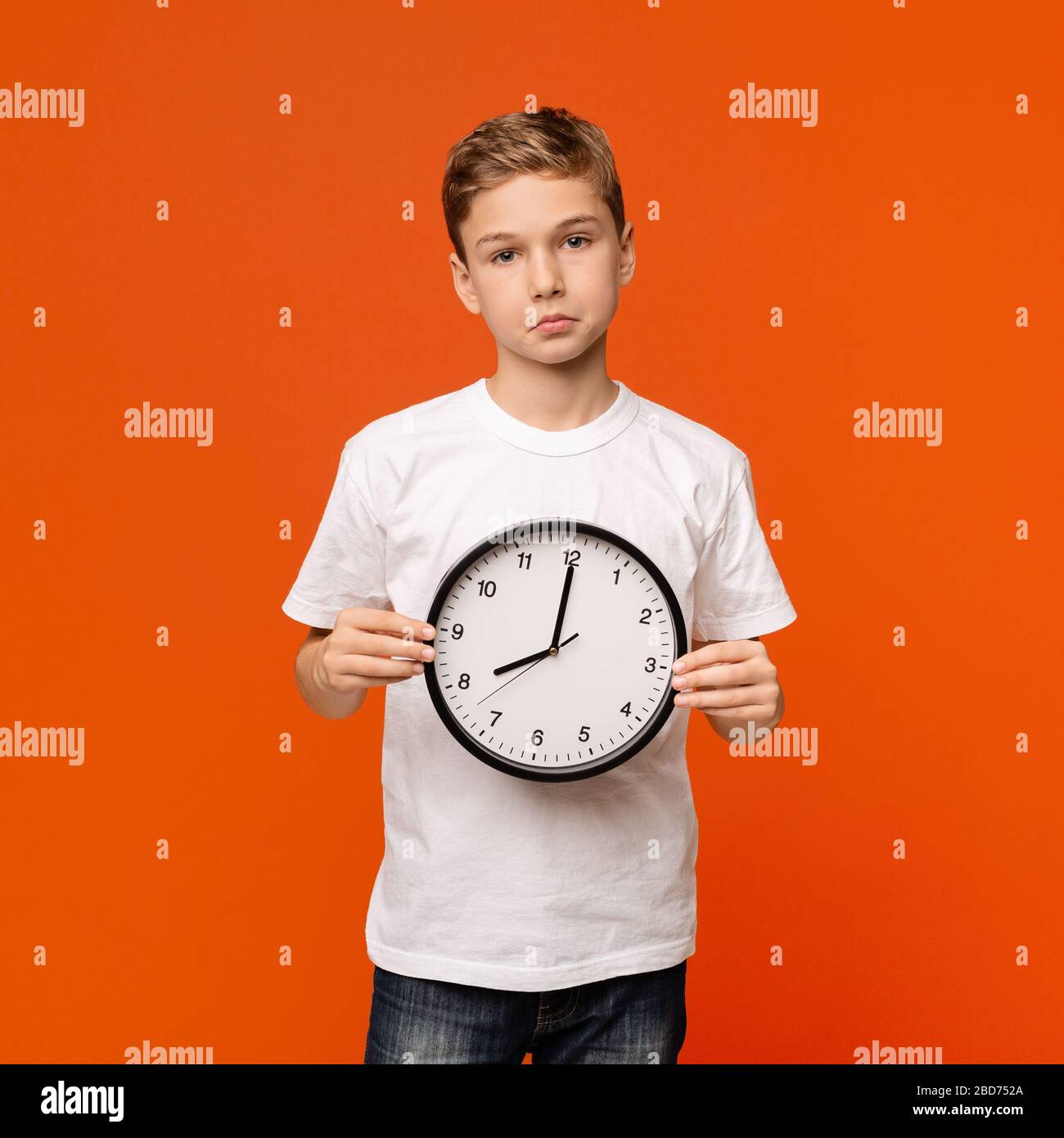 Boy showing clock hi-res stock photography and images - Alamy