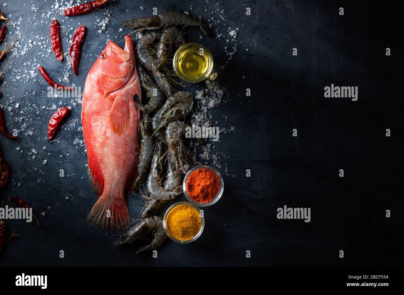 Red Snapper raw fish on table top Stock Photo - Alamy