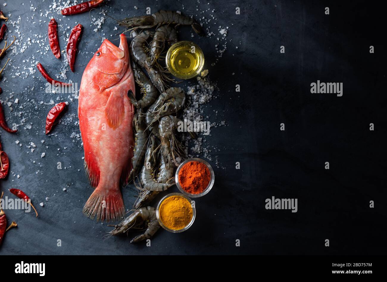 Red Snapper raw fish on table top Stock Photo - Alamy