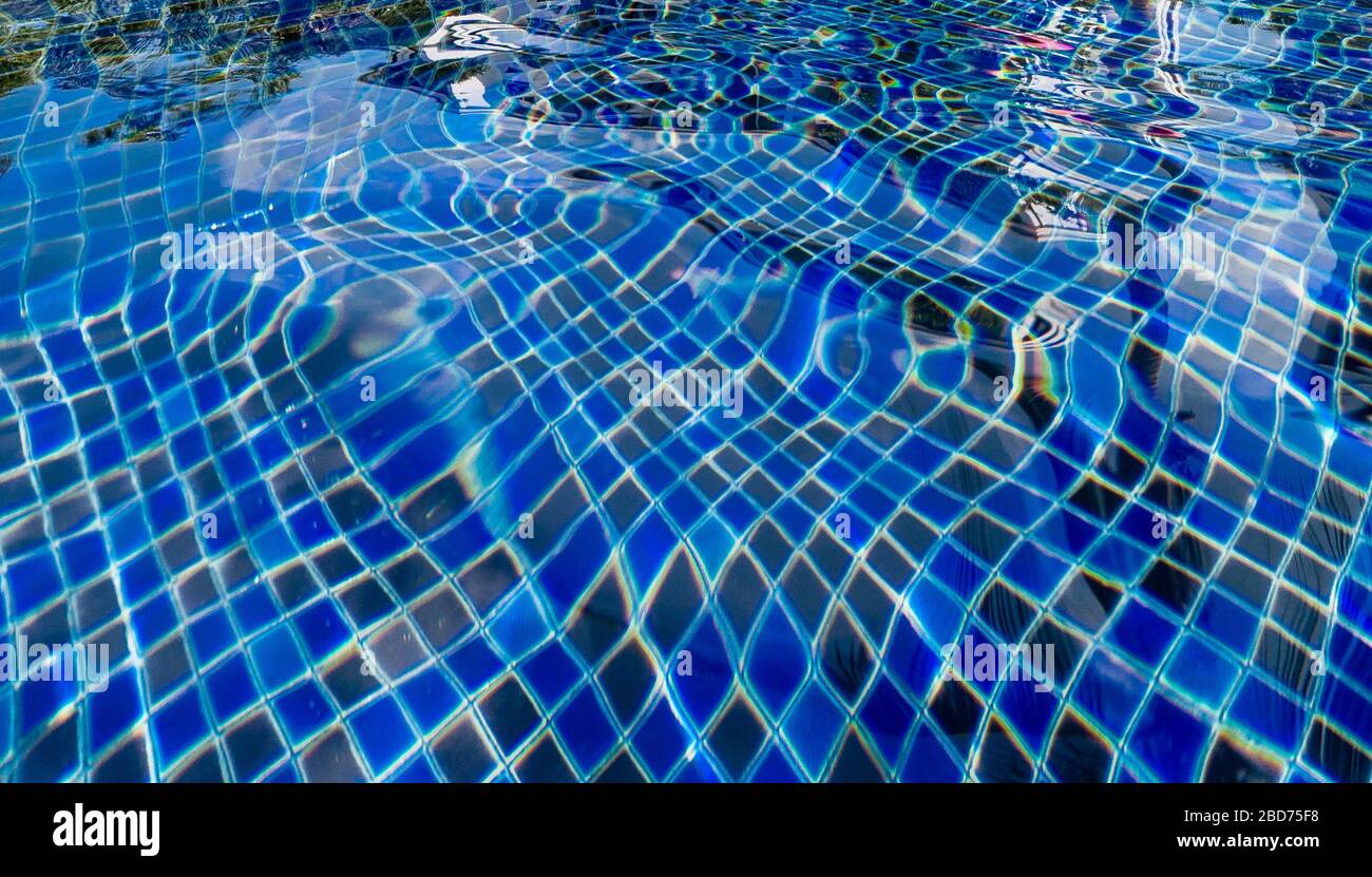 Disturbed clear water in a tiled swimming pool Stock Photo - Alamy