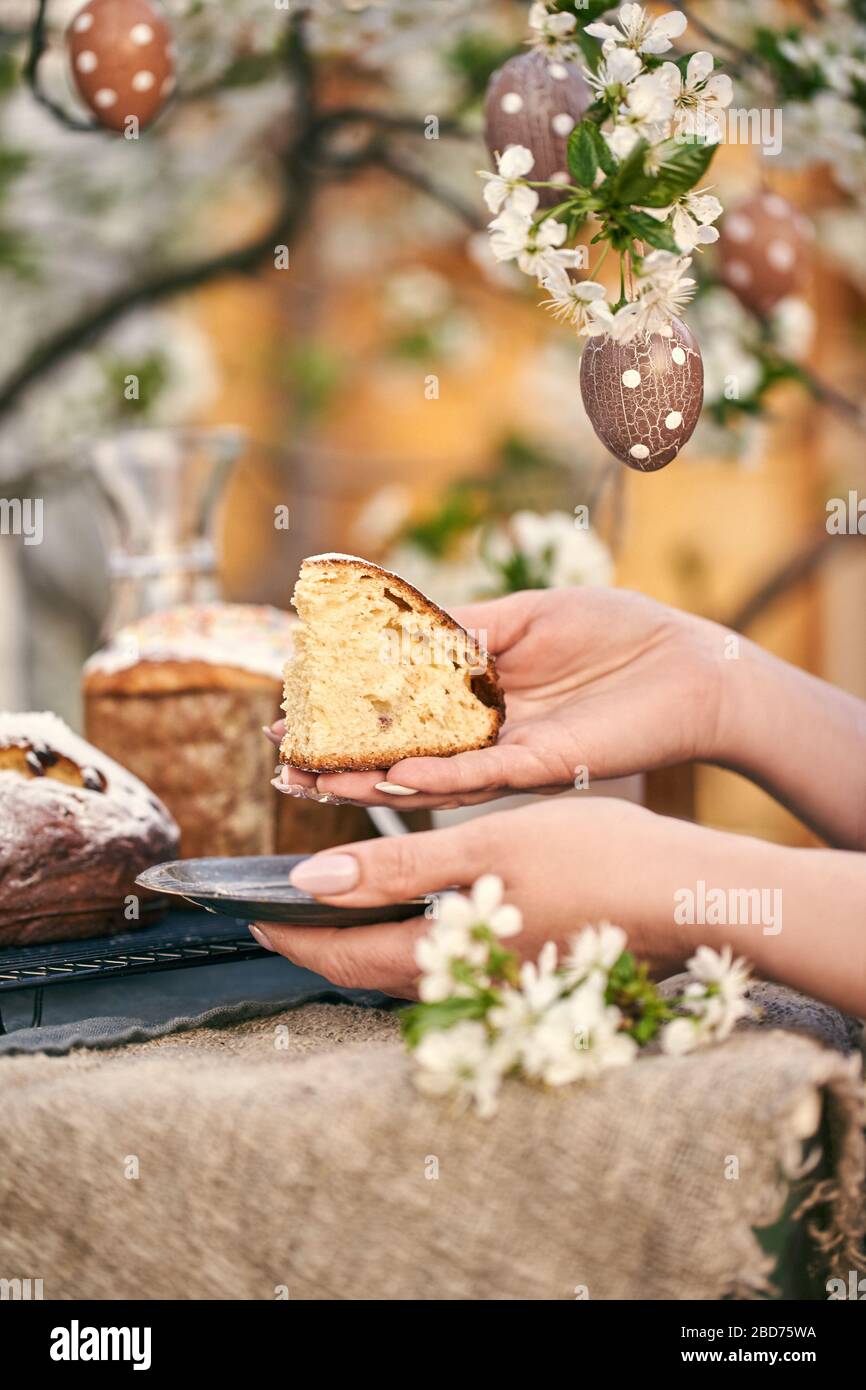 Traditional russian Easter cottage cheese dessert. Woman hands take a ...