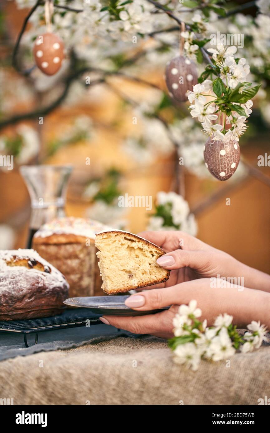 Traditional russian Easter cottage cheese dessert. Woman hands take a ...