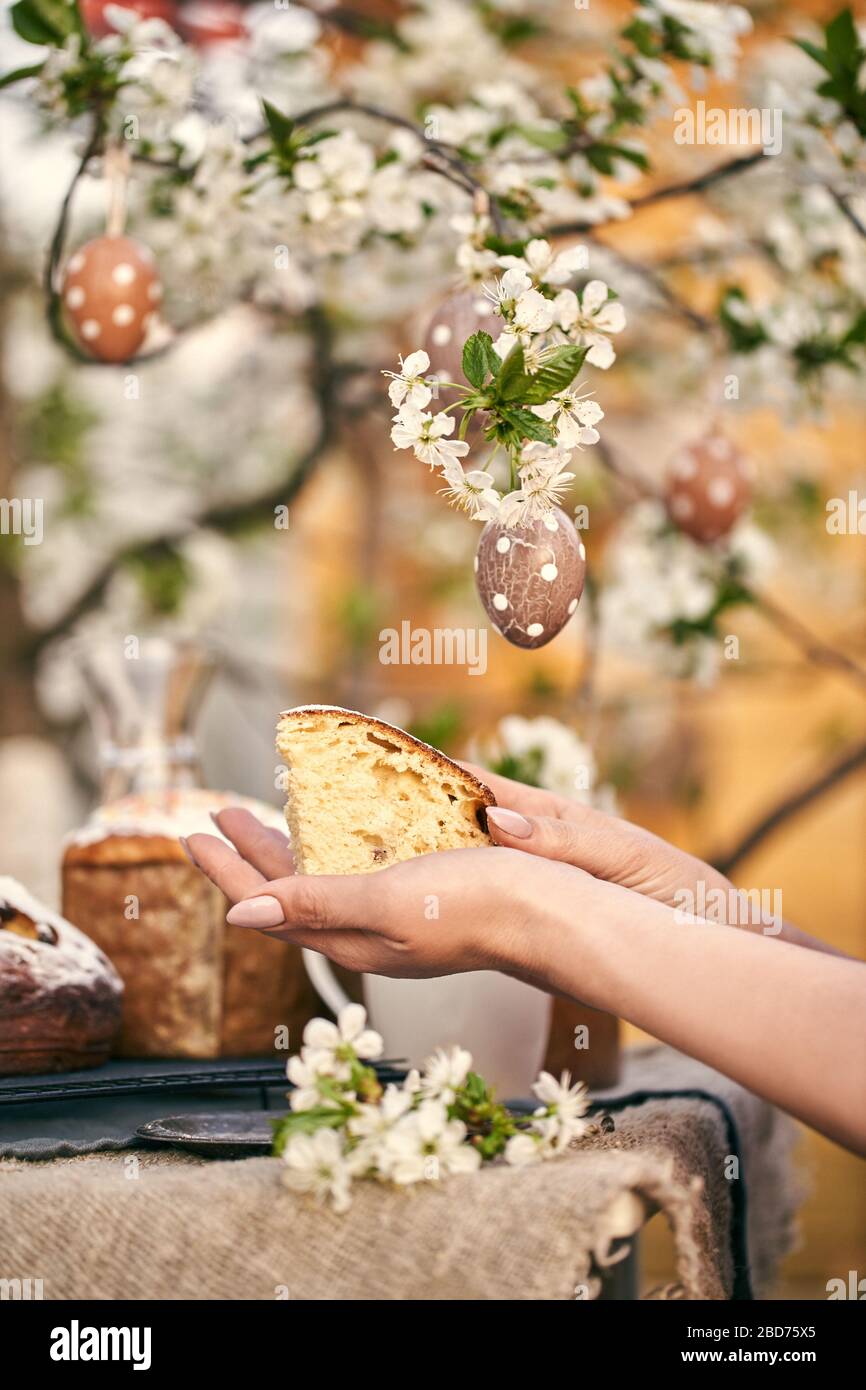 Traditional russian Easter cottage cheese dessert. Woman hands take a ...