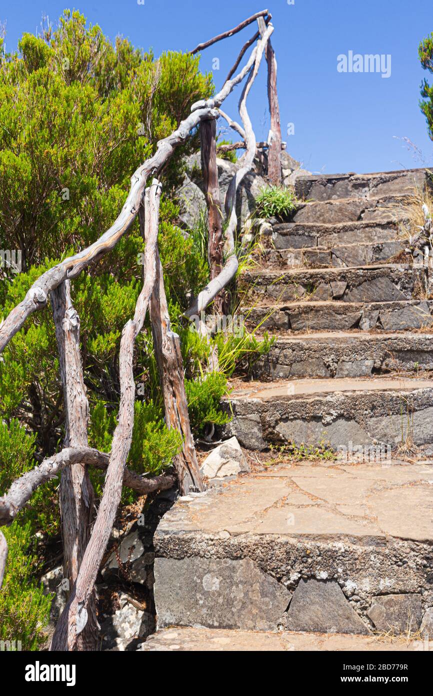 A stone staircase on a hiking trail in the mountains of Madeira ...