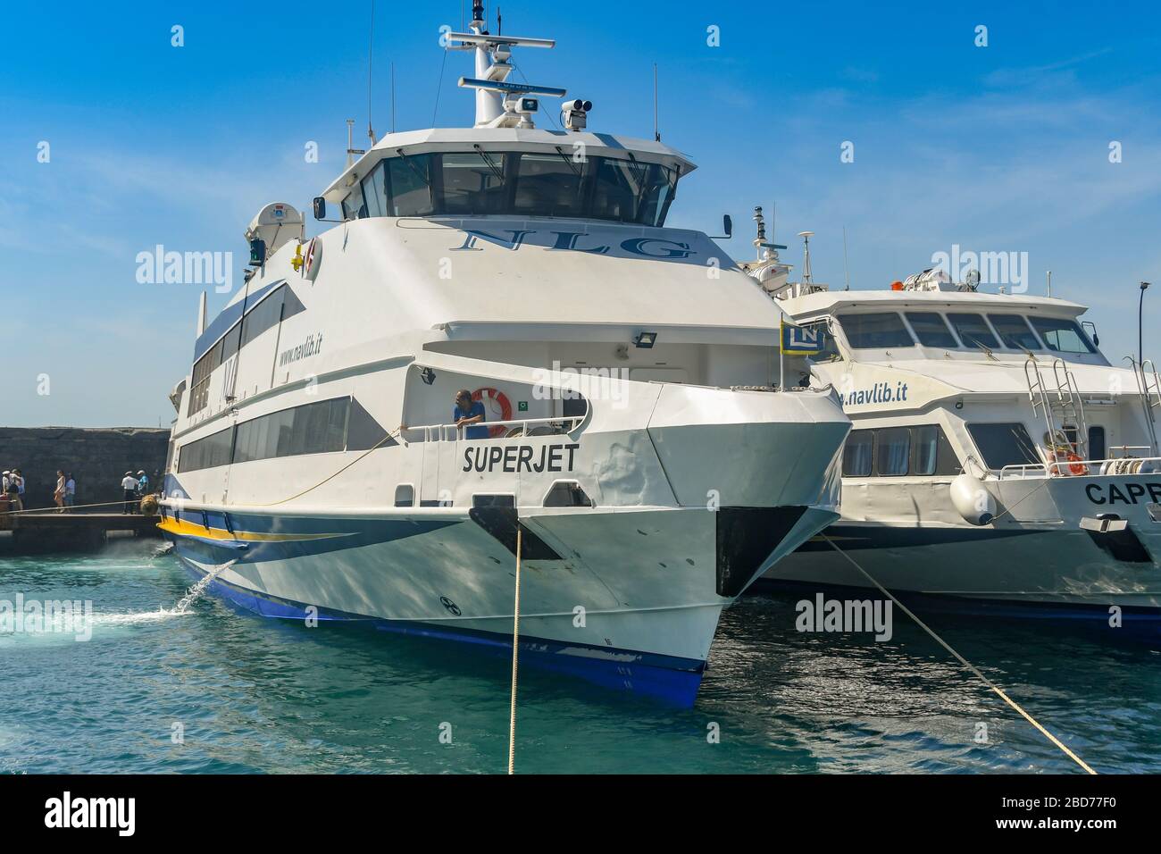 ISLE OF CAPRI, ITALY - AUGUST 2019: Passenger ferries in port on the ...