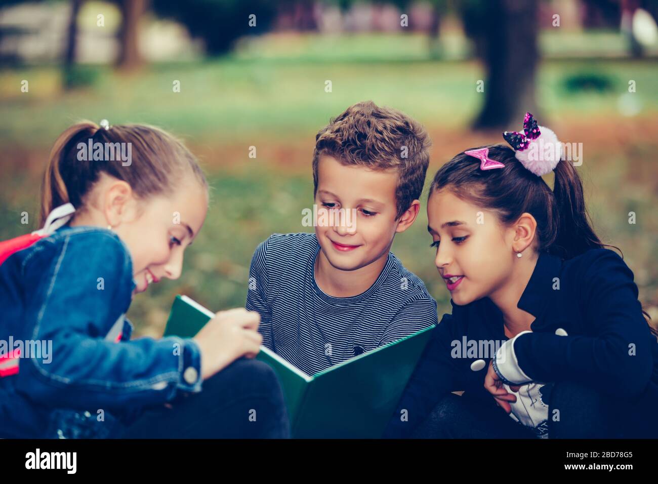 Back to school. Children with backpacks are having fun, talking ...