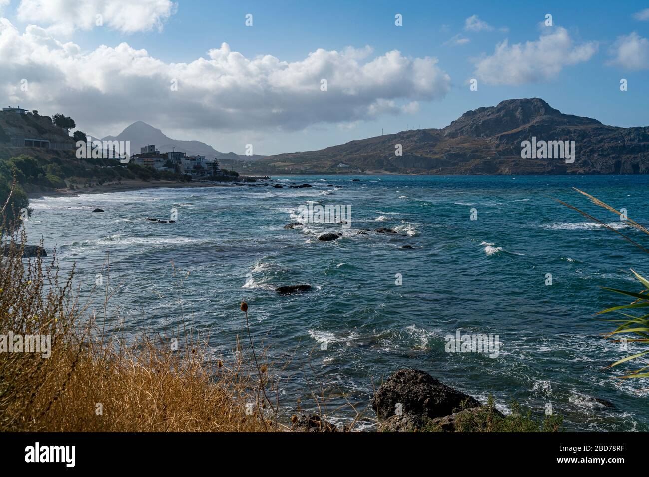Small village in a bay on Crete with mountains Stock Photo - Alamy